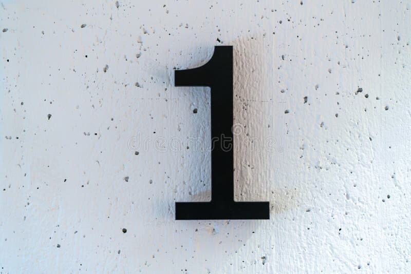 Number One 1 Floor Sign Symbol on White Concrete Wall Background with ...