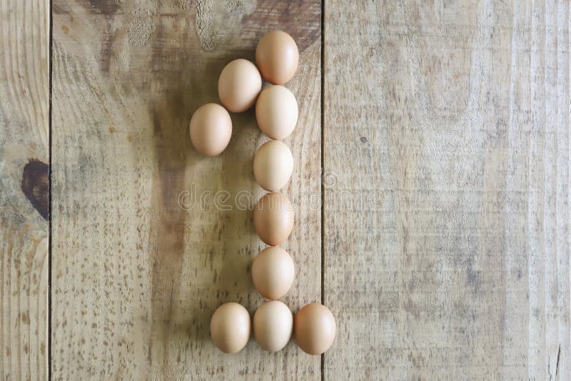 Number One Written with Chicken Eggs, Arranged on a Rustic Pine Wood ...