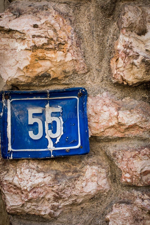 Number 55 Plaque on a House Wall Stock Photo - Image of placard, frame ...