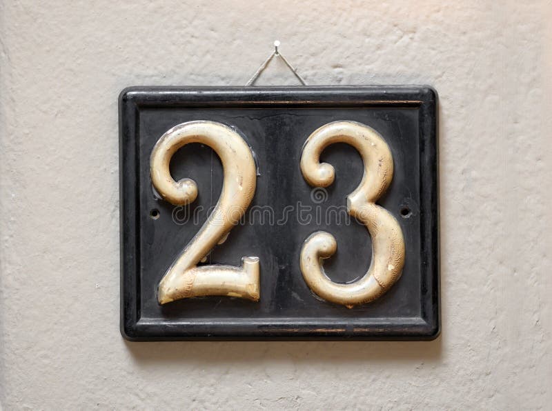 Number Plate with Numerals 23 Hanging on Wall Stock Photo - Image of ...