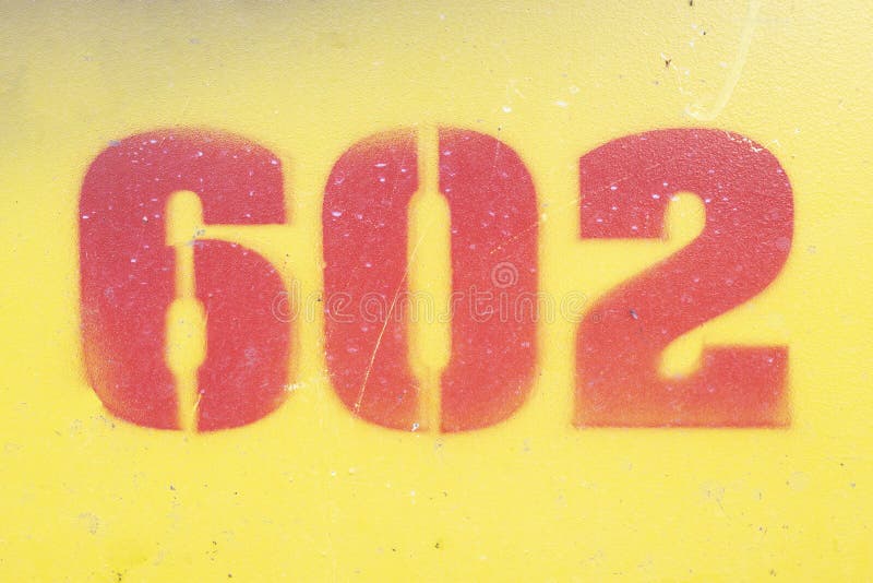 Number 602 in Red on Yellow, Painted in an Irregular Pattern on an Iron ...