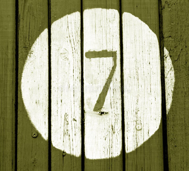 Number Seven on Yellow Wooden Wall Stock Image - Image of directional ...
