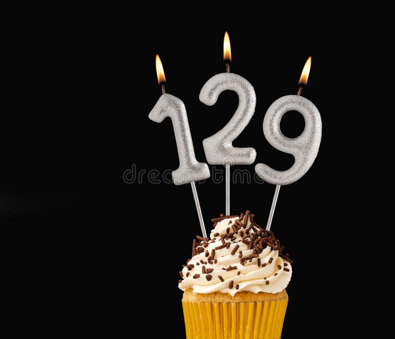 Number 129 Shaped Candles - Birthday Cupcake on Black Background Stock ...