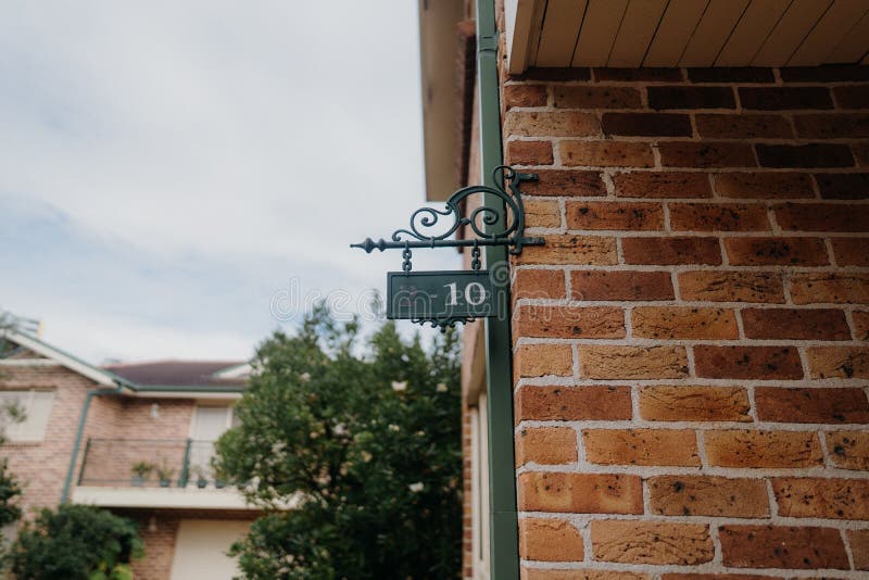 Number Sign on a Brick Wall of a Building Stock Image - Image of ...