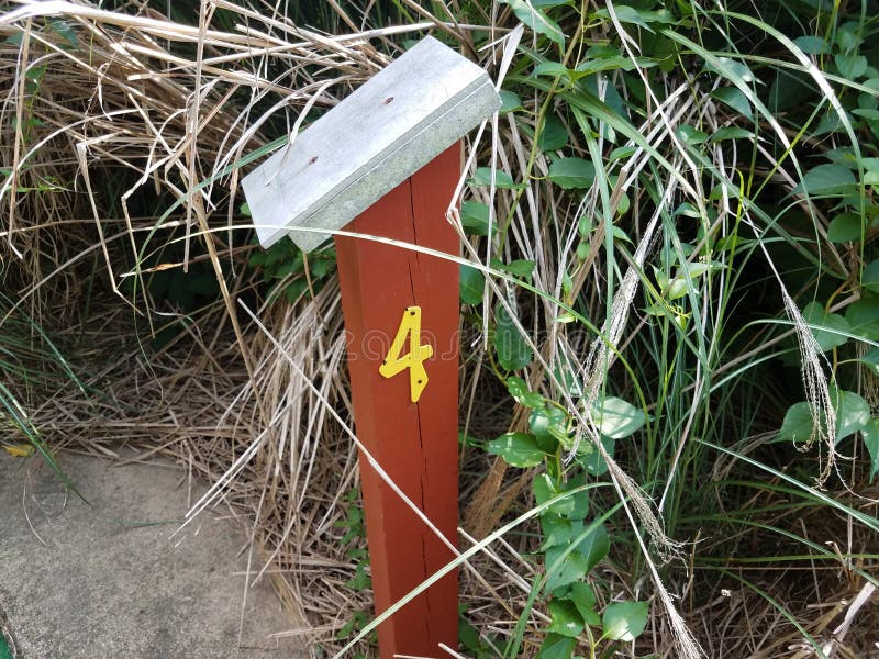 Number 4 Sign with Surface on Wood Post on Miniature Golf Course Stock ...
