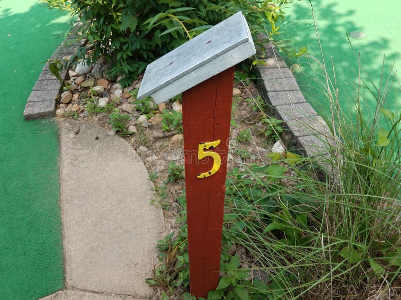 Number 11 Sign with Surface on Wood Post on Miniature Golf Course Stock ...