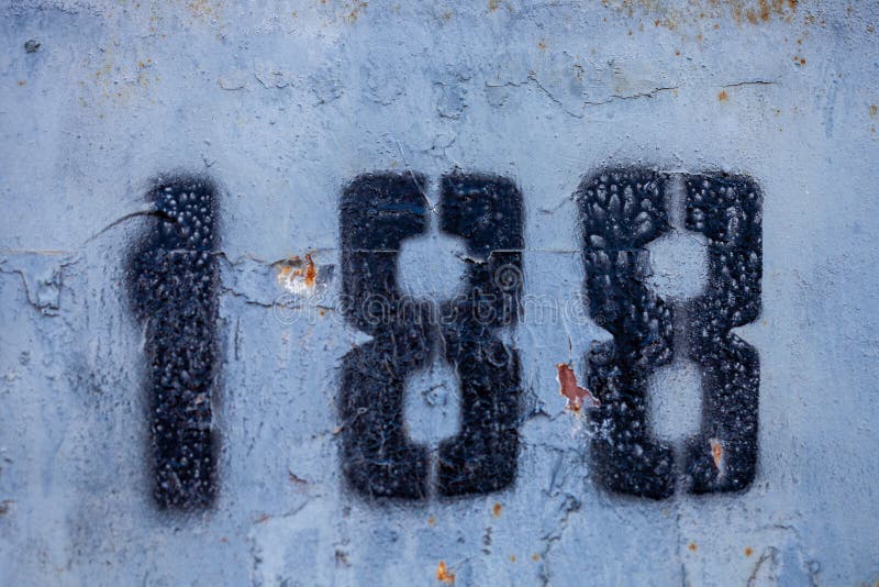 Number 188 on a stone wall stock photo. Image of numeral - 184117100