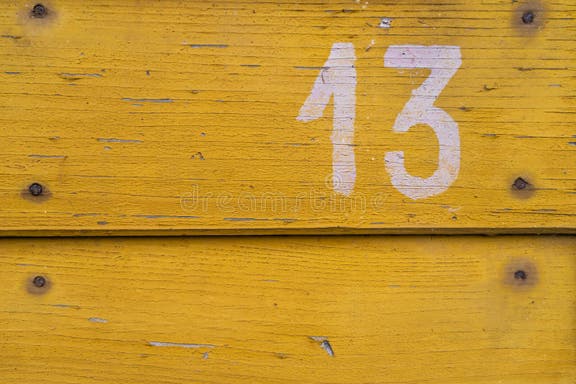 The Number Thirteen Painted on a Board with Old Nails Stock Photo ...
