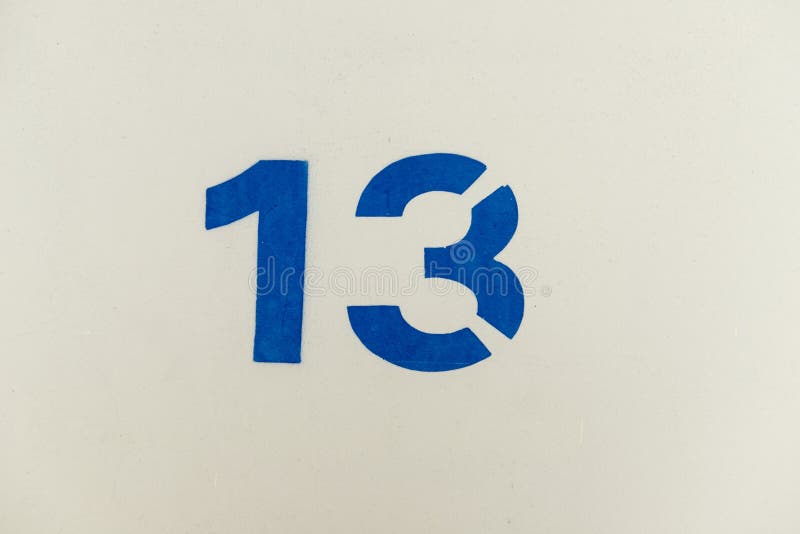 Number Thirteen Painted on a White Concrete Wall Stock Photo - Image of ...