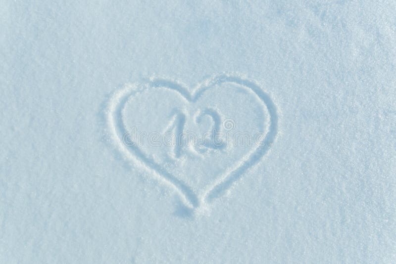 The Number Twelve Drawn on the Snow Surrounded by a Frame in the Heart ...