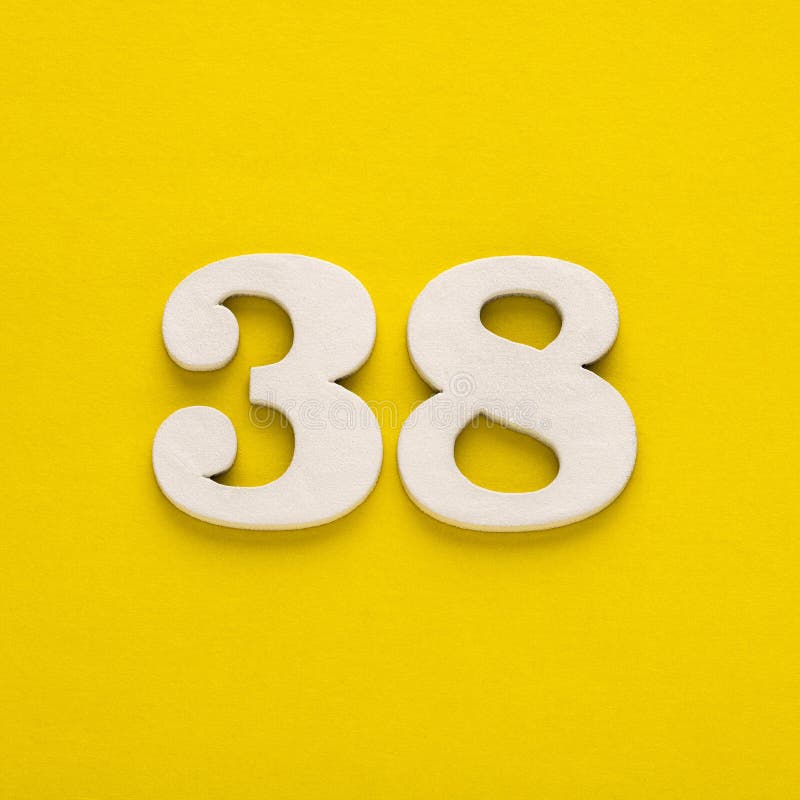 Number 38 - Two Figures in White on a Yellow Background Stock Photo ...