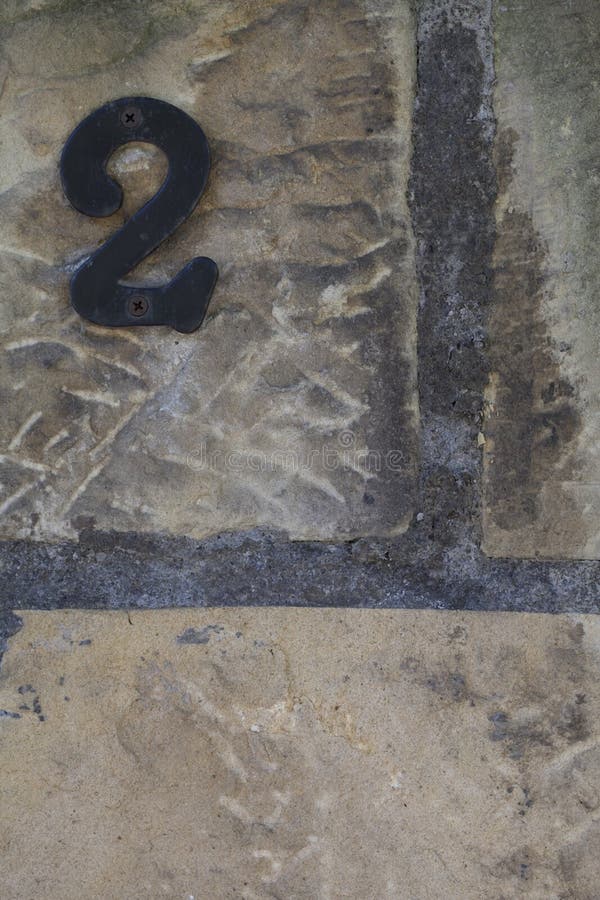 Number Two on Stone Wall stock image. Image of monochrome - 90141635