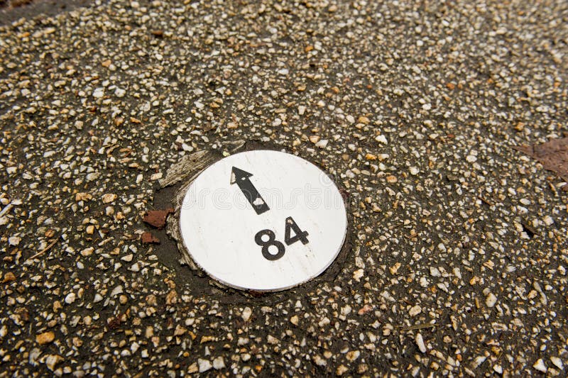 Numbered Direction Sign in Pavement Stock Photo - Image of print, rough ...
