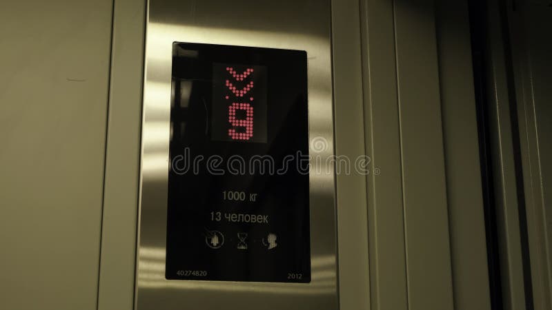 Numbers of Floors of Elevator Going Down. Concept. Elevator Doors Close ...