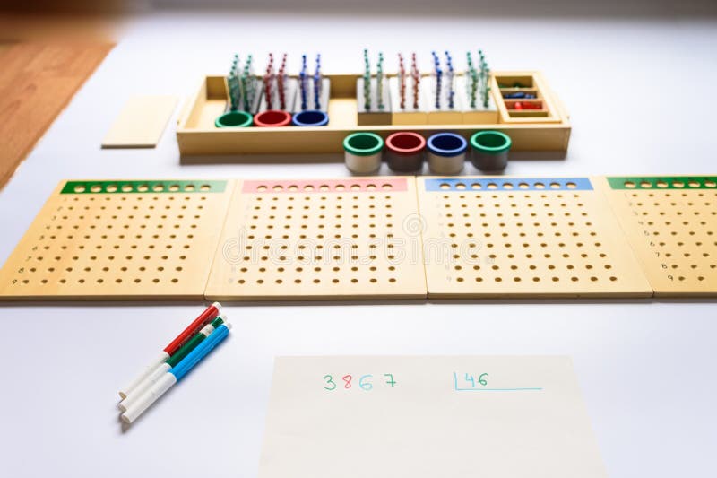 A Numerical Division Carried Out Following the Montessori Method Stock ...