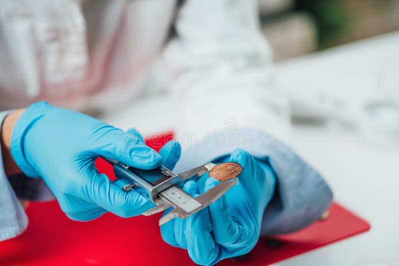Numismatics Expert Identifying and Documenting Coin Collection, Using ...