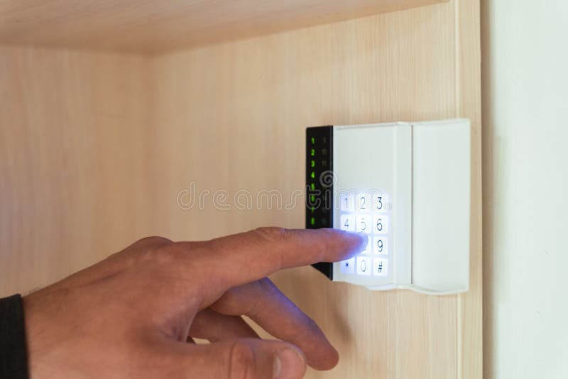 Remote Control Panel of the Security System in the Apartment. Entering ...