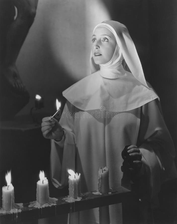 Nun Lights Candles in Church Stock Photo - Image of christian, flame ...