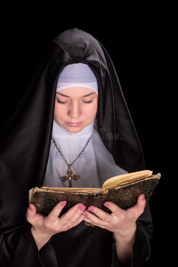 The nun read the old Book stock image. Image of innocent - 69059275