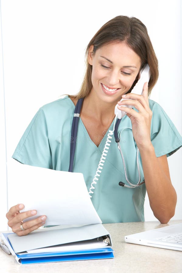 A Nurse on the Telephone stock photo. Image of station - 6446182
