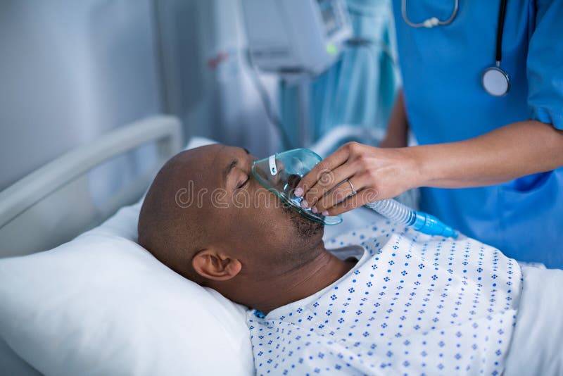 Nurse Adjusting Oxygen Mask on Patient Mouth Stock Photo - Image of ...