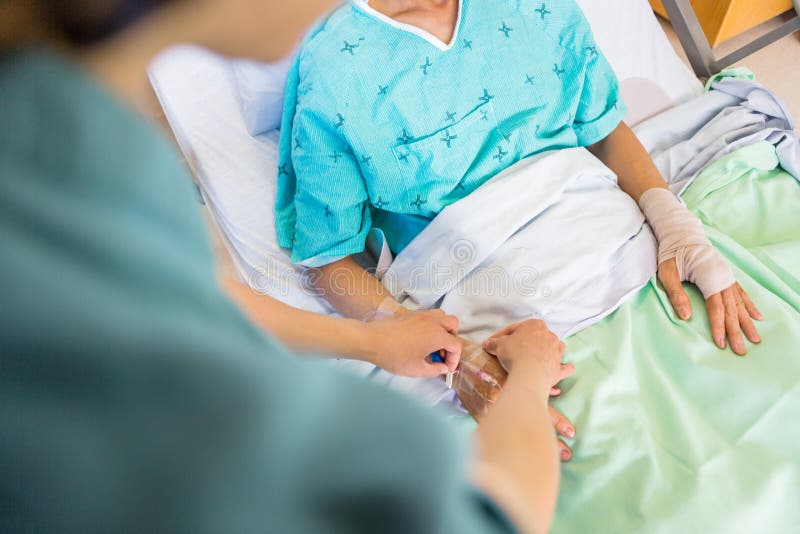 Nurse Attaching IV Drip on Male Patient S Hand in Stock Image - Image ... Nurse Attaching IV Drip on Male Patient S Hand in Stock Image - Image ...