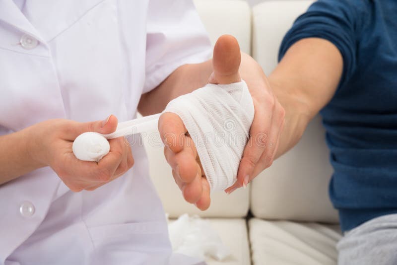 Nurse Bandaging A Hand And Arm Stock Image - Image of injury, medical ...