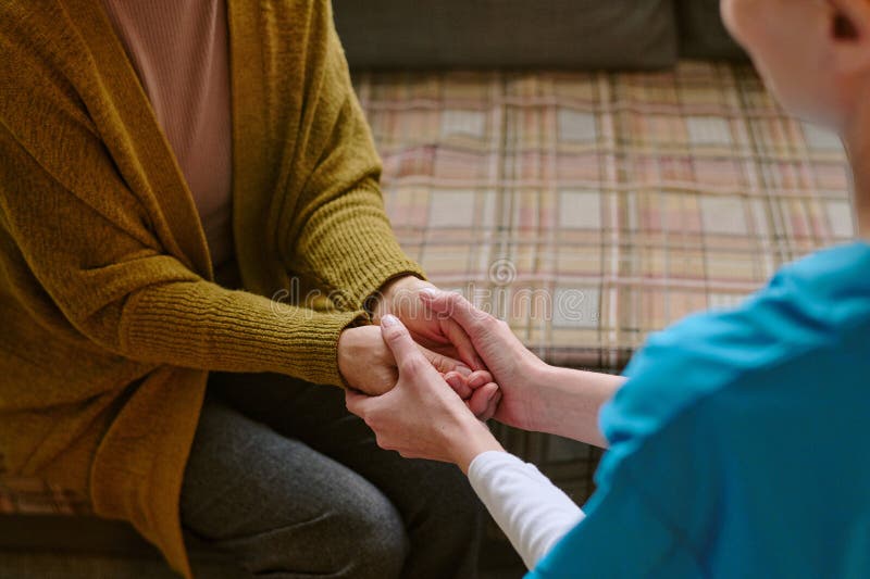 Nurse Calming Down Senior Woman Stock Photo - Image of hold, hand ...