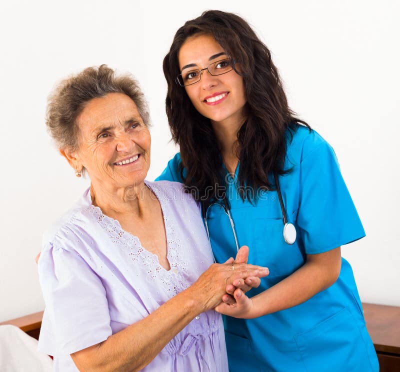 Nurses Caring for Elderly Patients Stock Photo - Image of happiness ...