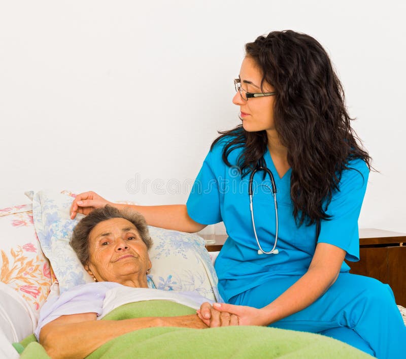 Nurses Caring for Elderly Patients Stock Photo - Image of happiness ...