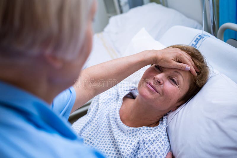 Nurse Checking Patient Temperature Stock Photo - Image of lying, adult ...