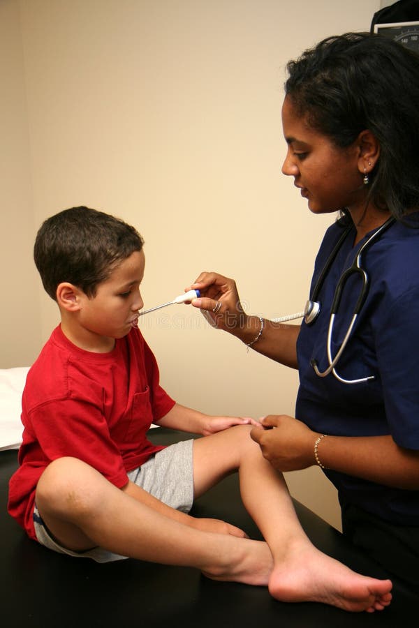 Nurse Checks Young Patient stock photo. Image of blue - 1311136
