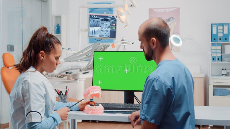 Nurse and Dentist Examining Teeth Layout Using Green Screen Stock Image ...