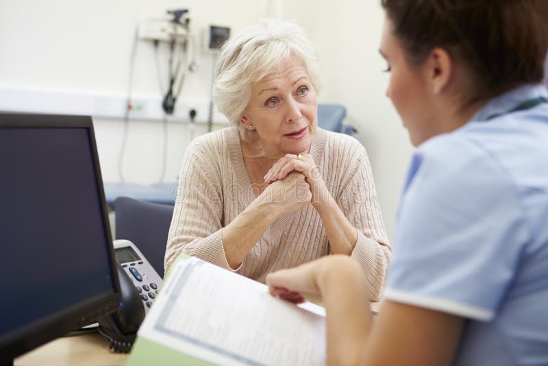 Nurse Discussing Test Results with Patient Stock Photo - Image of card ...