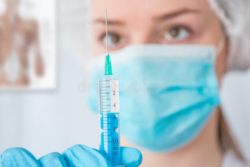 Nurse or Doctor Holding an Injection Needle . Stock Photo - Image of ...