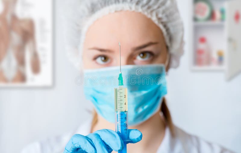 Nurse or Doctor Holding an Injection Needle . Stock Photo - Image of ...