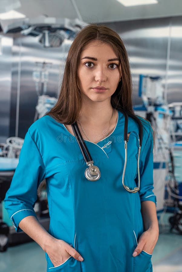 Nurse Or Doctor In Surgical Gown Before Surgery With Stethoscope Stock