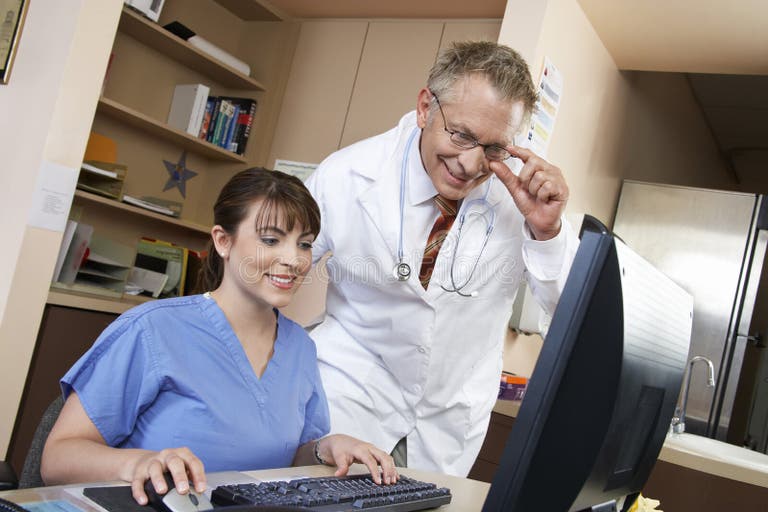Nurse with Doctor Using Computer Stock Image - Image of profession ...