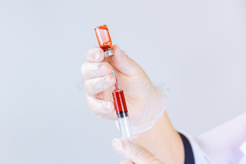 The Nurse Draws Blood into a Syringe from a Vial for Laboratory Testing ...