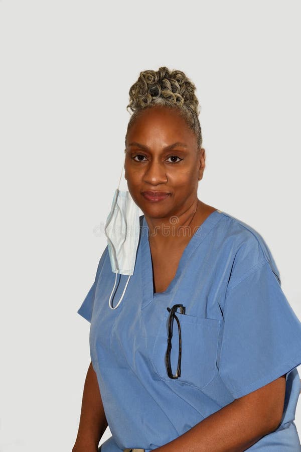 A Nurse Dressed in Hospital Scrubs Stock Photo - Image of drug, sitting ...