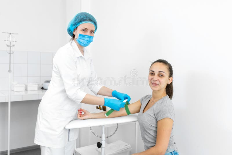 The Nurse Fastens the Clip on the Patient Hand before the Blood ...