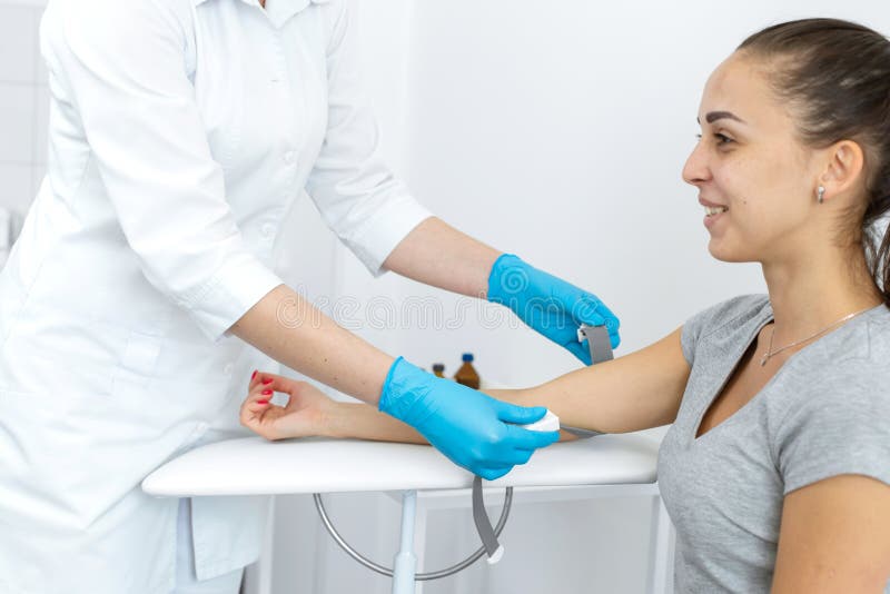 The Nurse Fastens the Clip on the Patient Hand before the Blood ...