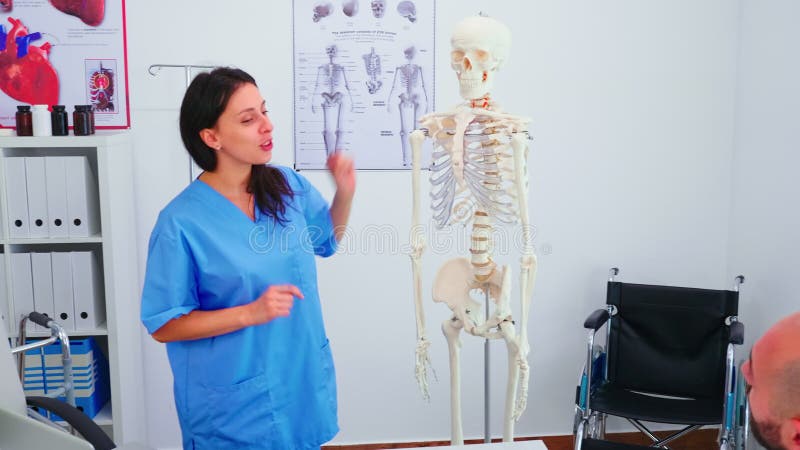 Nurse Giving Presentation Using Skeleton Model Stock Video - Video of ...