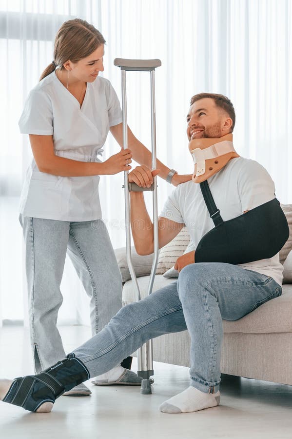 Nurse is Helping Injured Man at Home Stock Image - Image of fracture ...