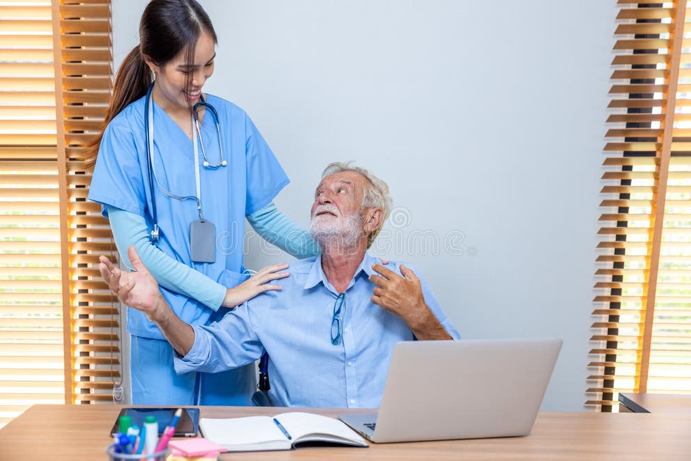 Nurse Helping Patient for Using Computer Notebook . Caretaker and ...