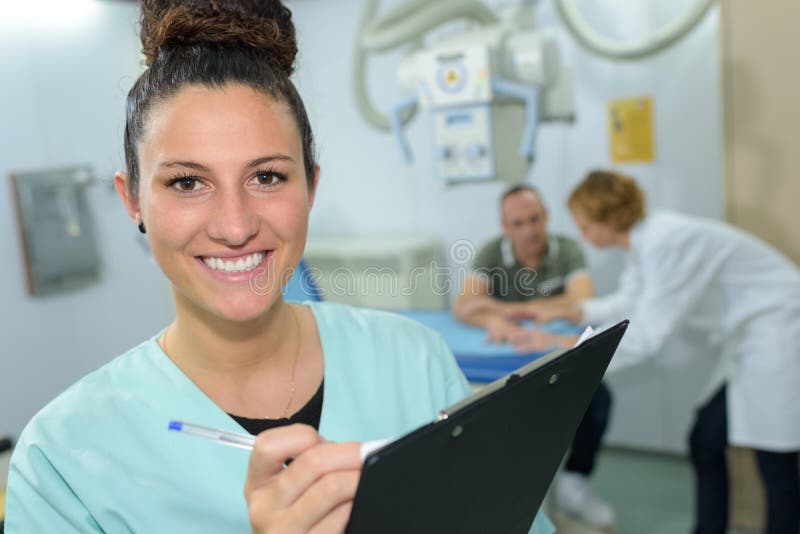 Nurse holding a clipboard stock image. Image of recording - 173912391