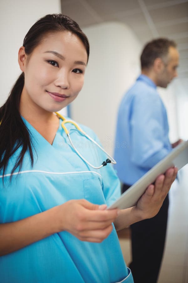 Nurse Holding Digital Tablet Stock Image - Image of cheerful ...