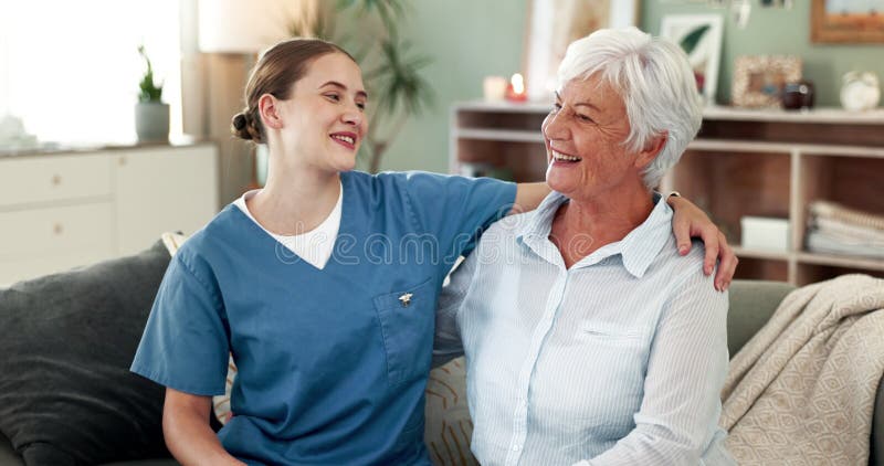 Nurse Hug And Elderly Woman On Sofa In Retirement Home Nursing Care