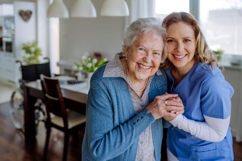 Young Nurse Hugging Her Senior Woman Client. Stock Image - Image of ...