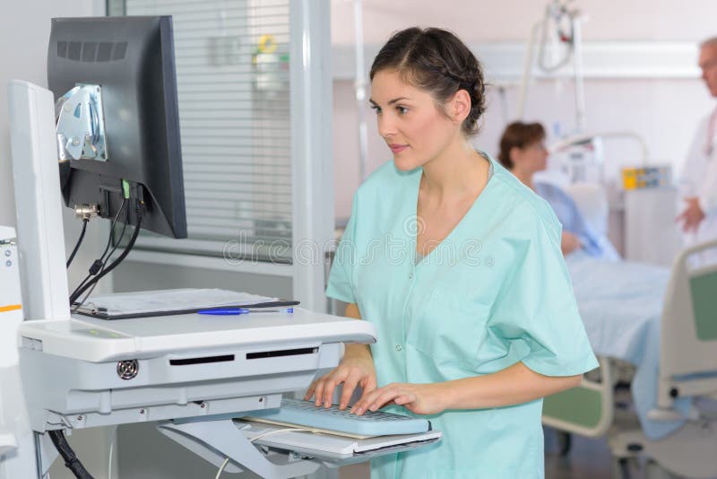 Nurse Looking at X-rays on Computer Screen Stock Photo - Image of ...